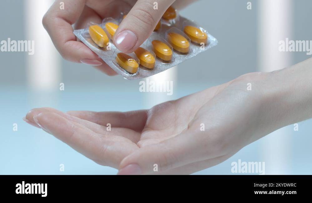 Female hand take vitamin tablet from blister pill. Vitamin tablets ...