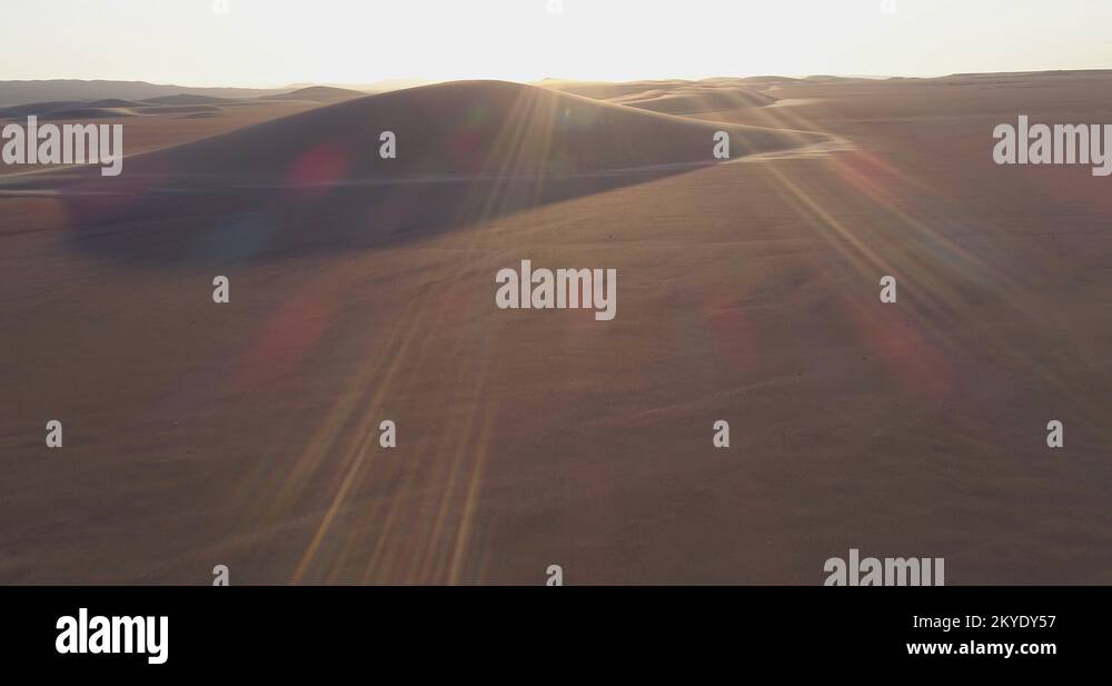 4K sunset aerial fly over view of the sand dunes in the Namib desert ...