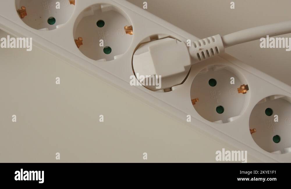 Man's Hand Turns Off The Plug From The Socket Electrical Extension Cord ...