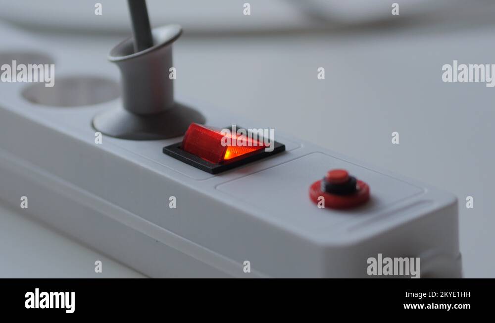 Male Hand Unplugging The Plug From Socket Electric Extension Cord And ...