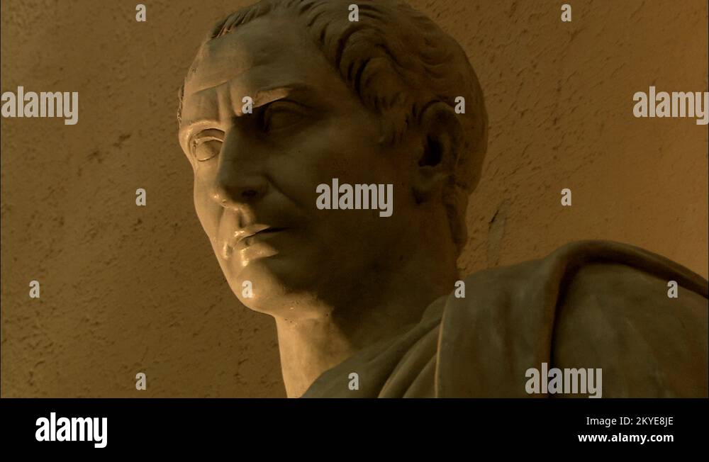 Marble statue of Julius Caesar with shadow on wall behind Stock Video ...