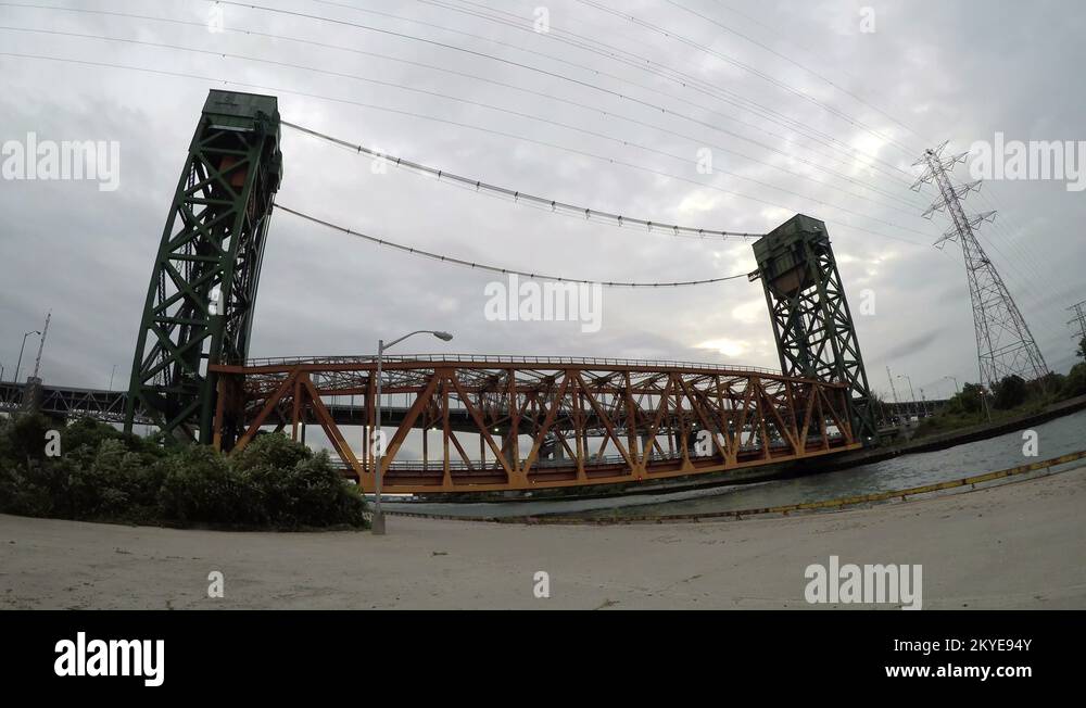 Timelapse of vertical lift bridge going up and down on a cloudy ...