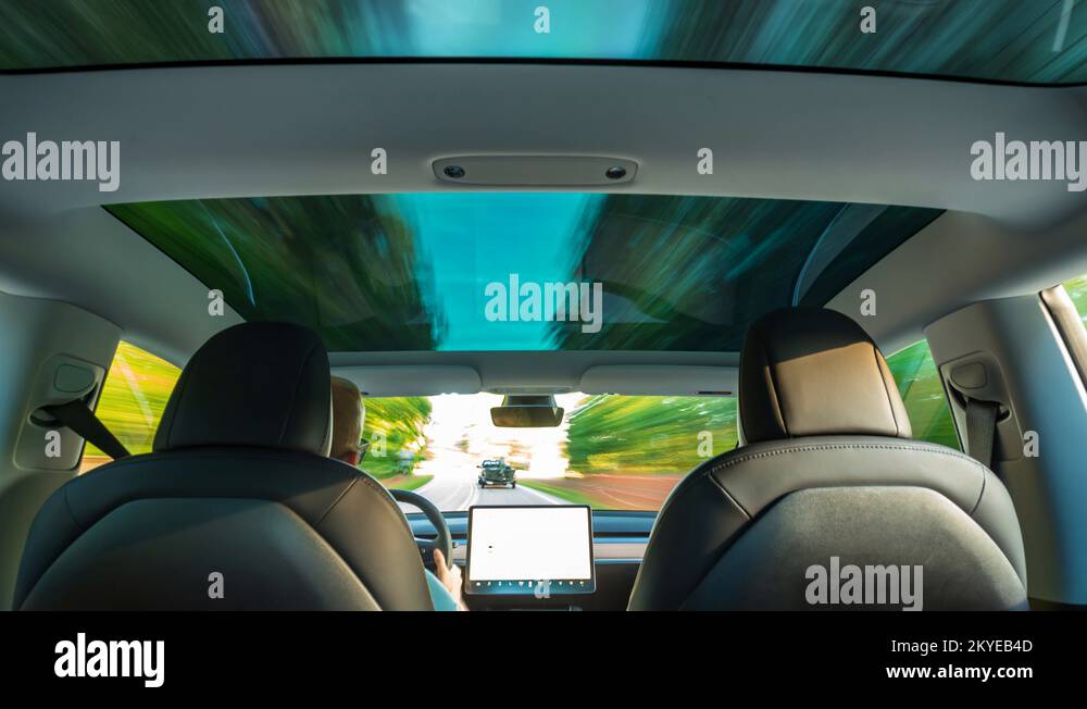 Person driving a new Tesla Model 3. The model 3 is set to be the Tesla ...