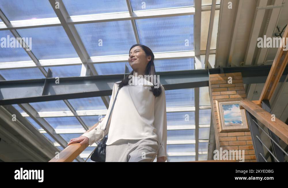 Woman descending Stock Videos & Footage - HD and 4K Video Clips - Alamy