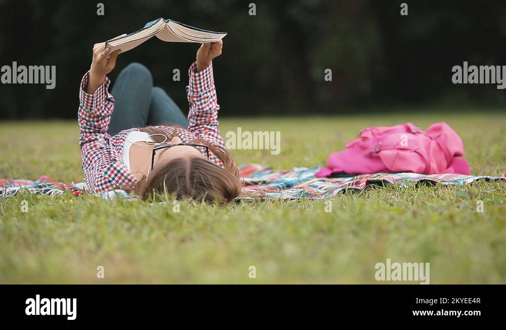 Reading on grass Stock Videos & Footage - HD and 4K Video Clips - Alamy