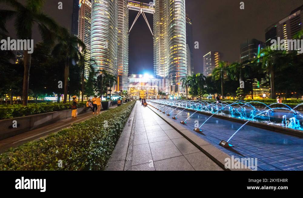 People visit the KLCC City Center at night in Kuala Lumpur Stock Video ...