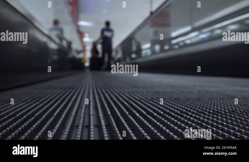 Airport travelator walkway with anonymous passengers Stock Video ...