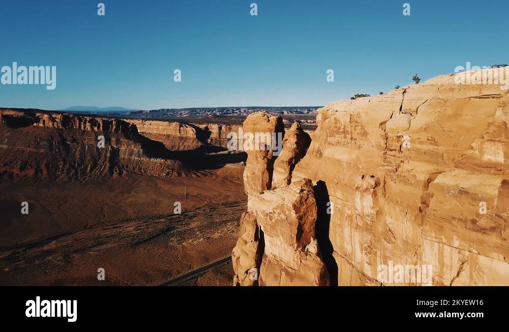 Drone turning right over giant cliff to reveal epic mountain canyon ...