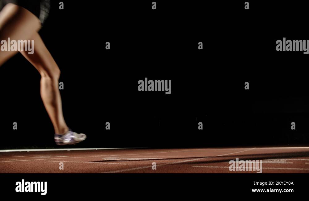 Athlete running on short track. Female asian runner heading forward on ...