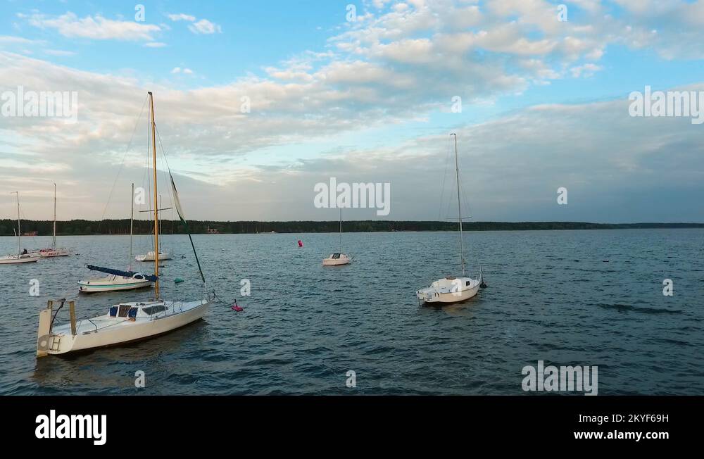 Panning of pleasure yacht and boat group anchored in peaceful calm ...