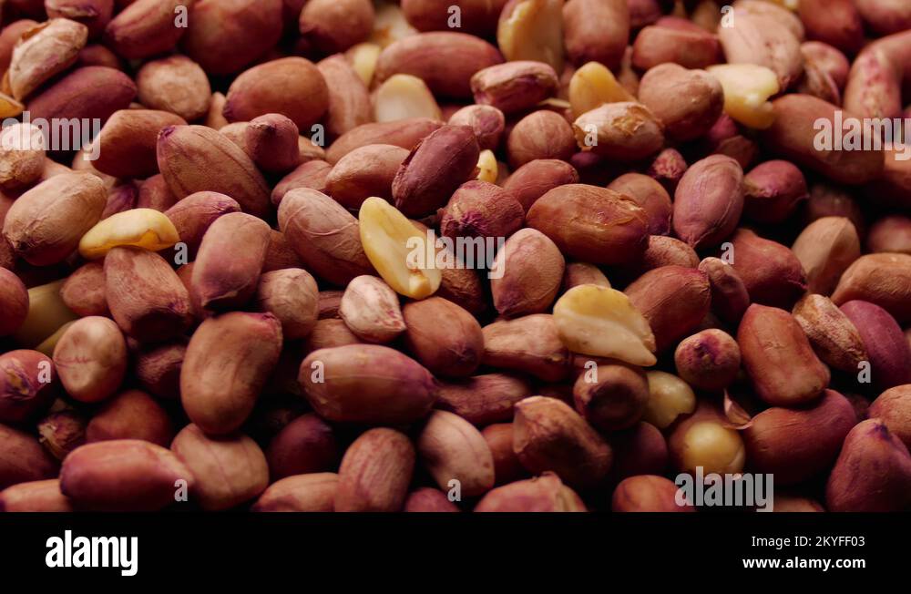 Spinning Pile of Roasted Peanuts in Dark Red Skins Stock Video Footage ...