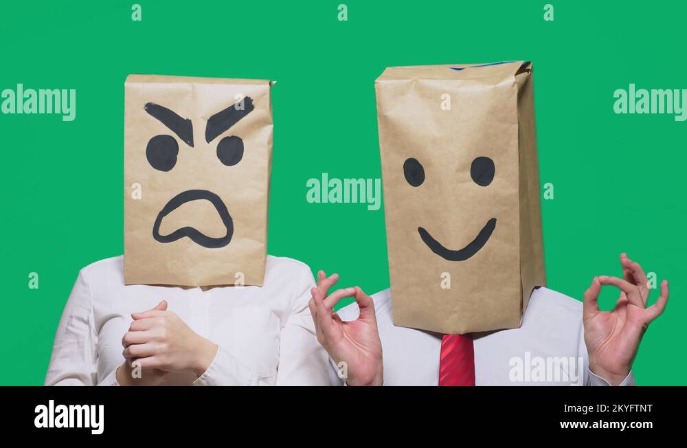 The concept of emotions and gestures. Two people in paper bags on the ...