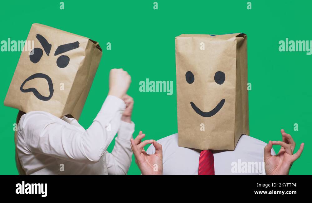 The concept of emotions and gestures. Two people in paper bags on the ...