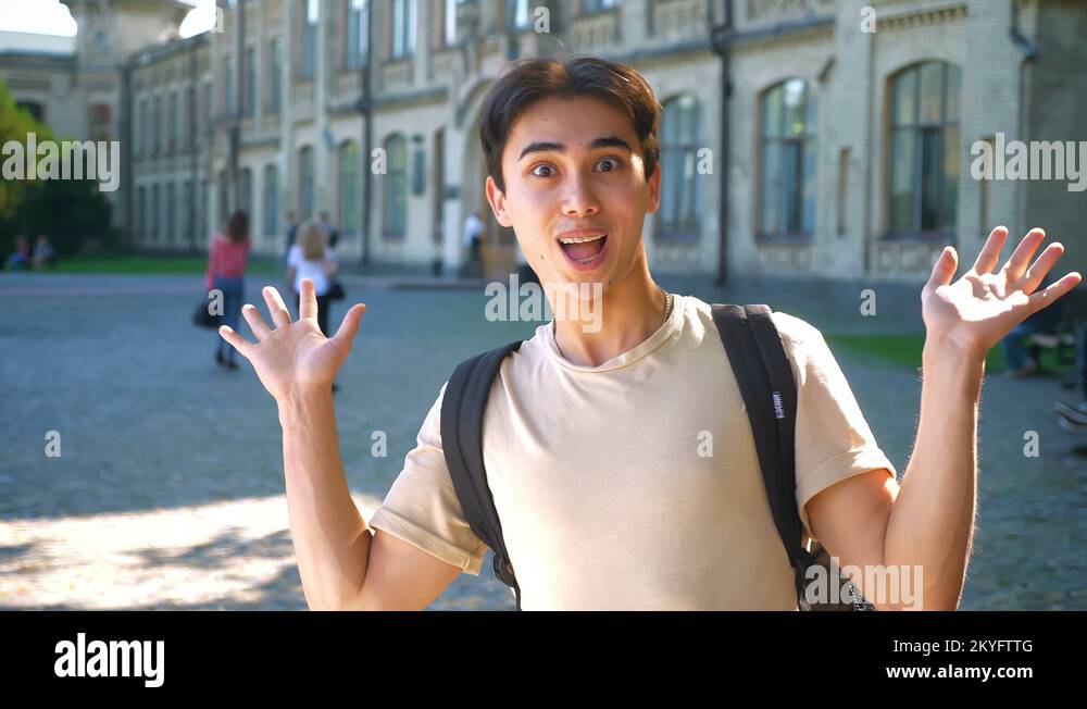 Awesome surprised asian guy is showing confused gesture with emotional ...