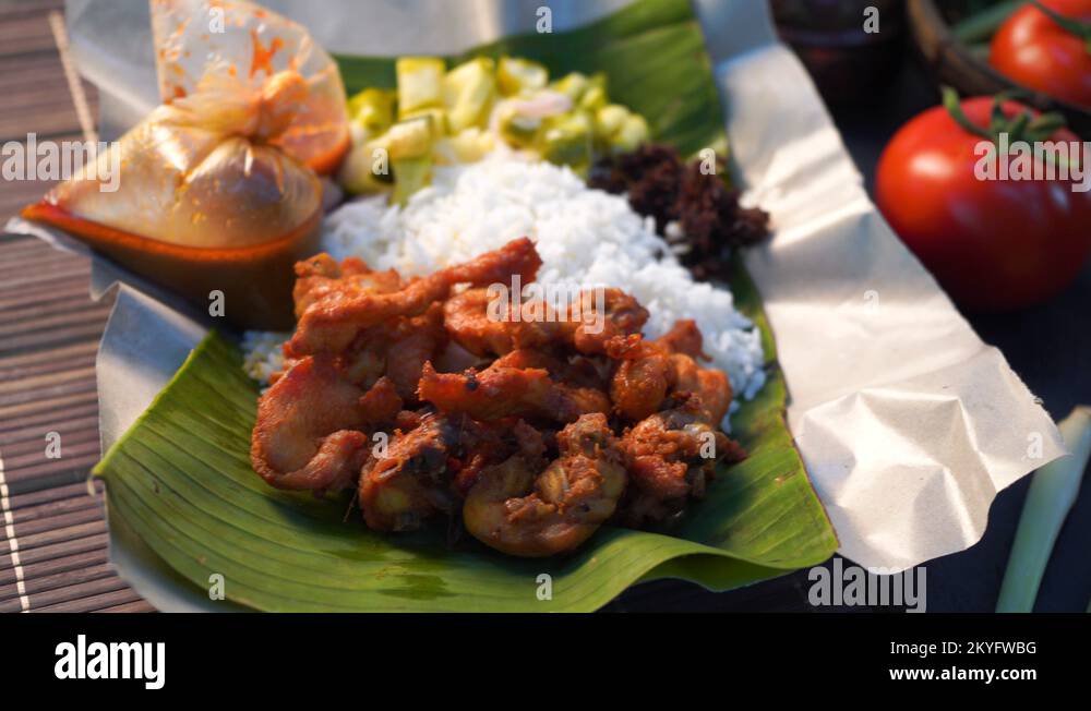 nasi kukus, traditional malay steamed rice with tumeric fried chickens ...