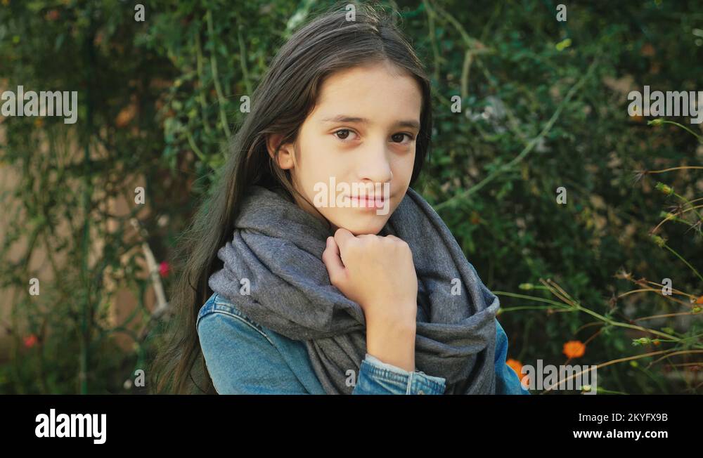 Portrait of beautiful young girl walking outdoors in autumn. She poses for the Stock Video ...