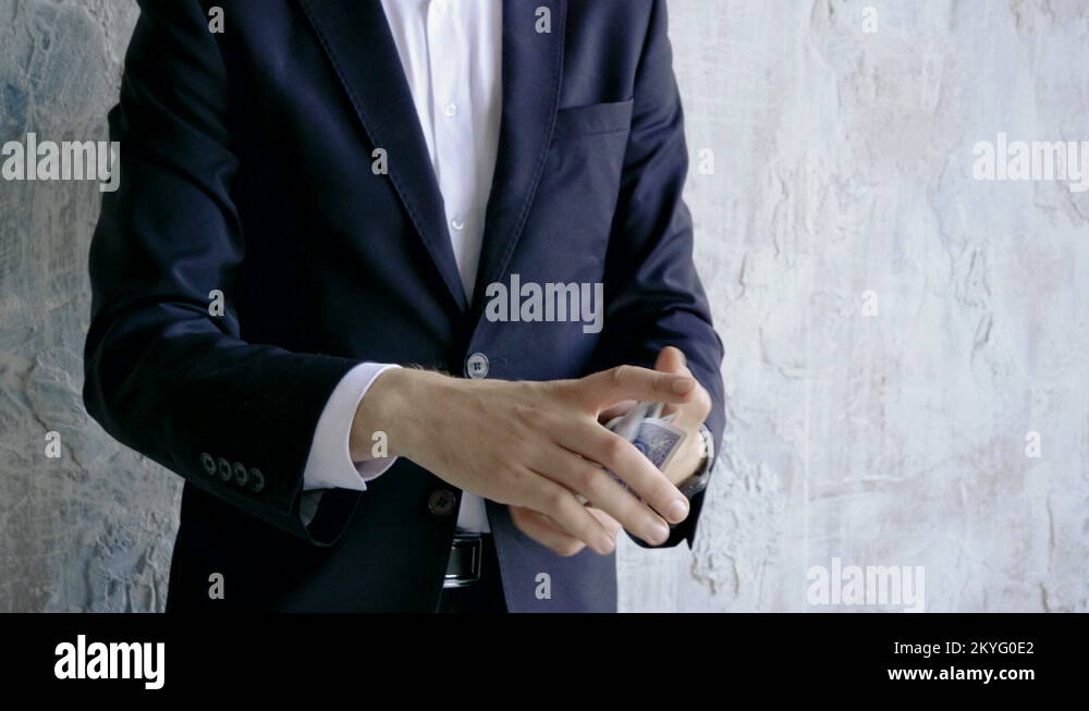 Magician's hands performing card trick. Throwing, catching cards in the ...