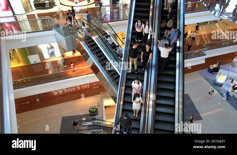Escalator in modern multilevel shopping mall crowd of people. Rush hour Stock Video Footage - Alamy