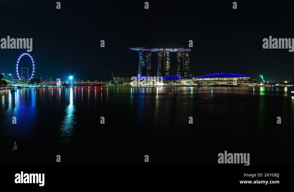 Singapore Flyer and MBS Hotel viewed at night from across the quay ...