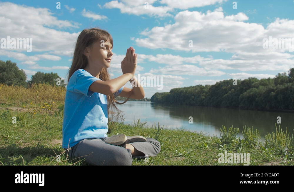 A child in the lotus position Stock Video Footage - Alamy