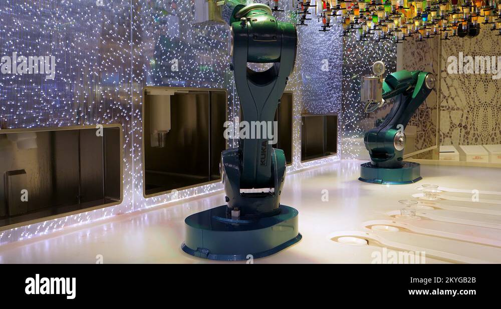 Drink served by robotic arm bartenders in bionic bar on a cruise ship ...