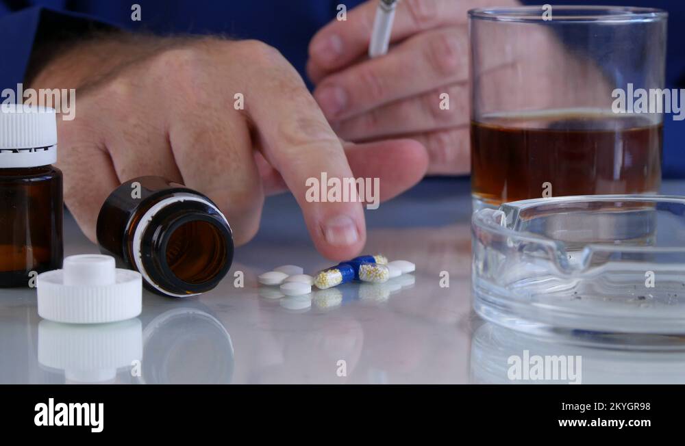 Man on the Table Select Medical Pills Drink Alcohol and Smoke a ...