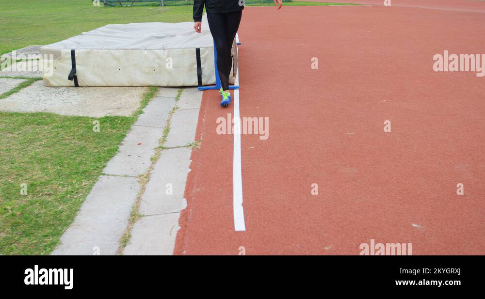 Female athlete measuring high jump field with footstep 4k Stock Video ...
