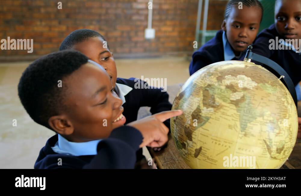Schoolkids using globe in classroom at school 4k Stock Video Footage ...