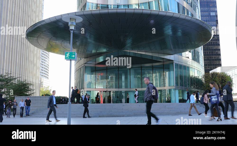 Crowd Of People Walking In Front Of The EDF Tower In La Defense Stock ...
