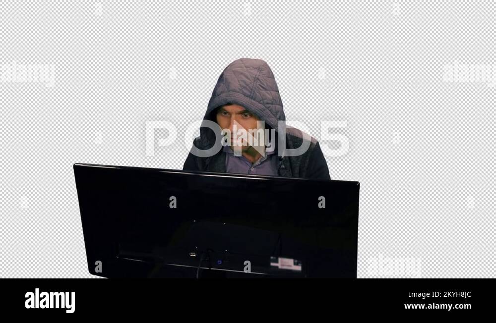 Hacker sitting in front of monitor, looking at screen and exulting ...