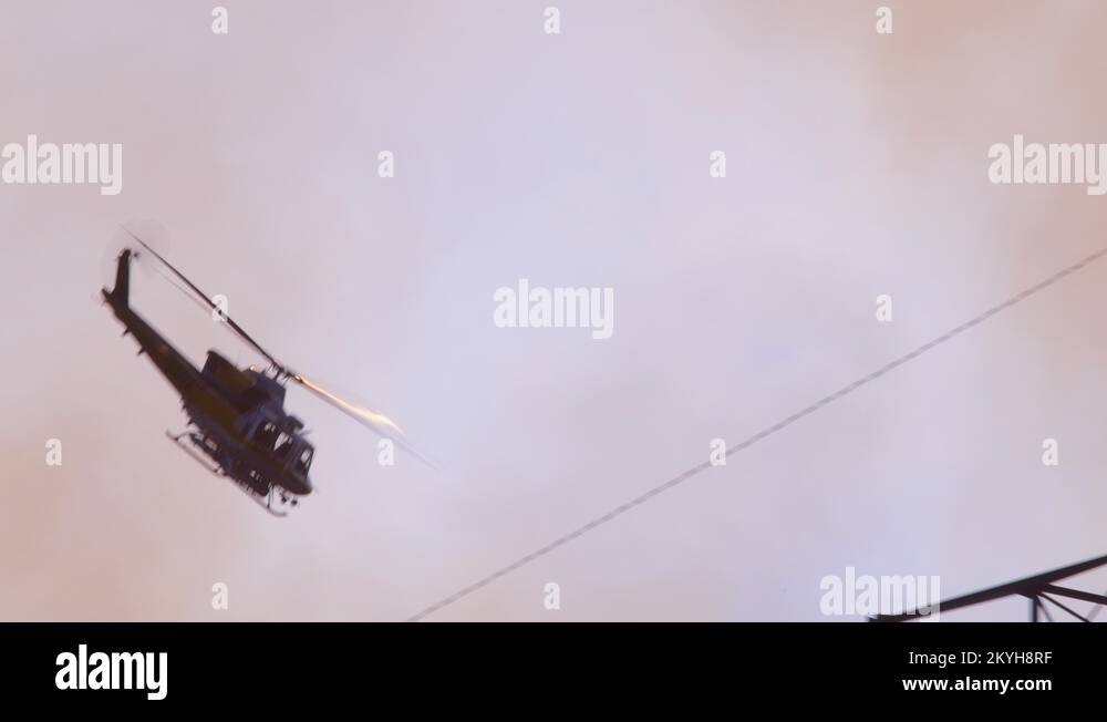 WATER DROPPING HELICOPTER WORKS NEAR HIGH VOLTAGE POWER LINES, IN 4K ...