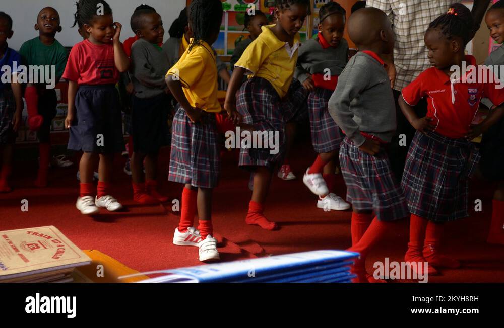Black African kids are practicing and learning dance and jumping up and ...