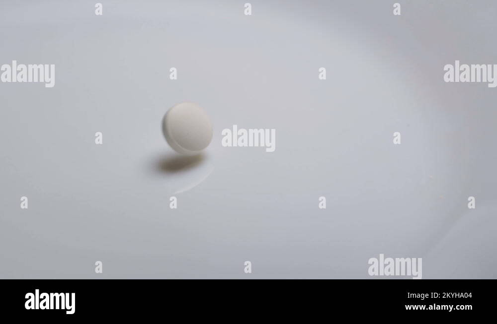 Colorful capsules of the medication is falling down and crumble from ...