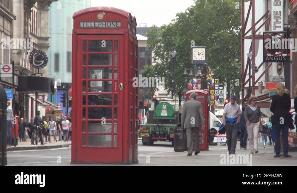 London Image with Traditional Phone Booth on a Crowded Street Stock ...