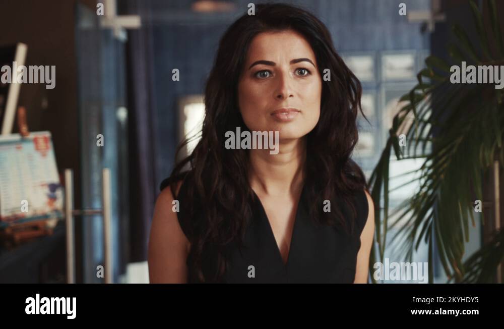 Portrait attractive charming young woman goes to a modern restaurant in ...