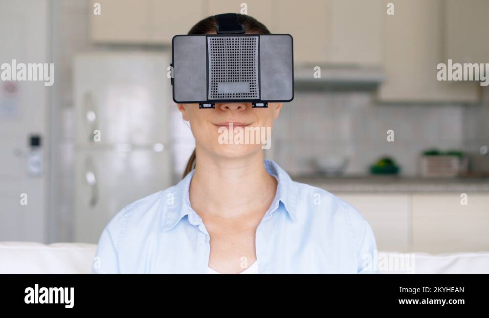 Young woman in VR 360 glasses make thumbs up gesture. Female using ...