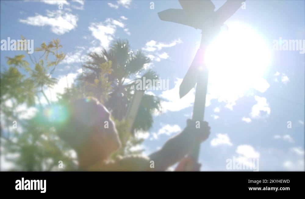 Man with an Wind propeller Craft in a windy day. Wind energy concept ...