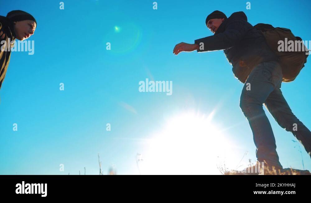 teamwork tourists business travel trip lends a helping hand. two men ...