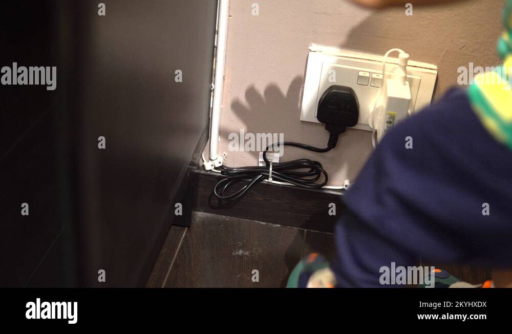 A kid turning off a wall switch. Safety and hazard concept Stock Video ...
