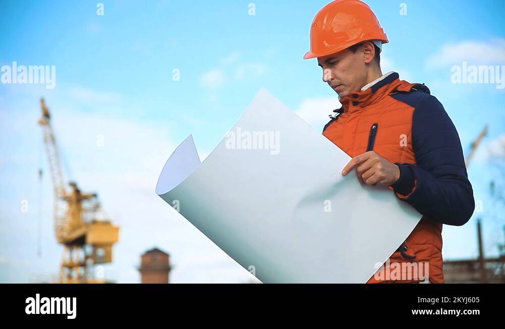 Engineering builder man Consulting People on construction site holding ...