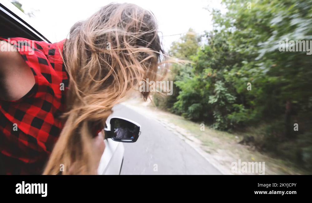 Girl with her head outside of the window in the car Stock Video Footage ...