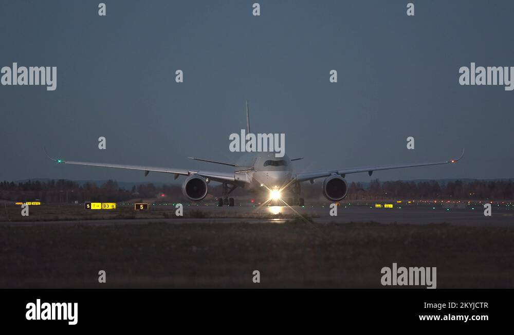 airplane qatar airways airbus a350 taxiing late night low angle view ...
