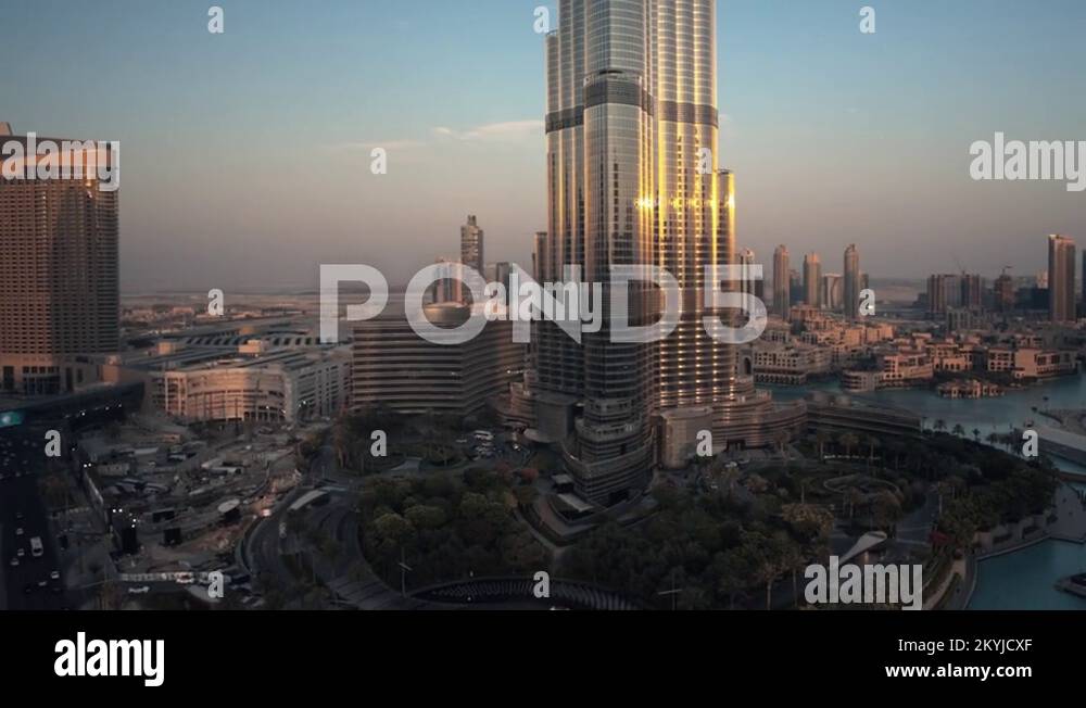 Track left past base of Burj Khalifa at 60m to reveal Dubai Mall, The ...