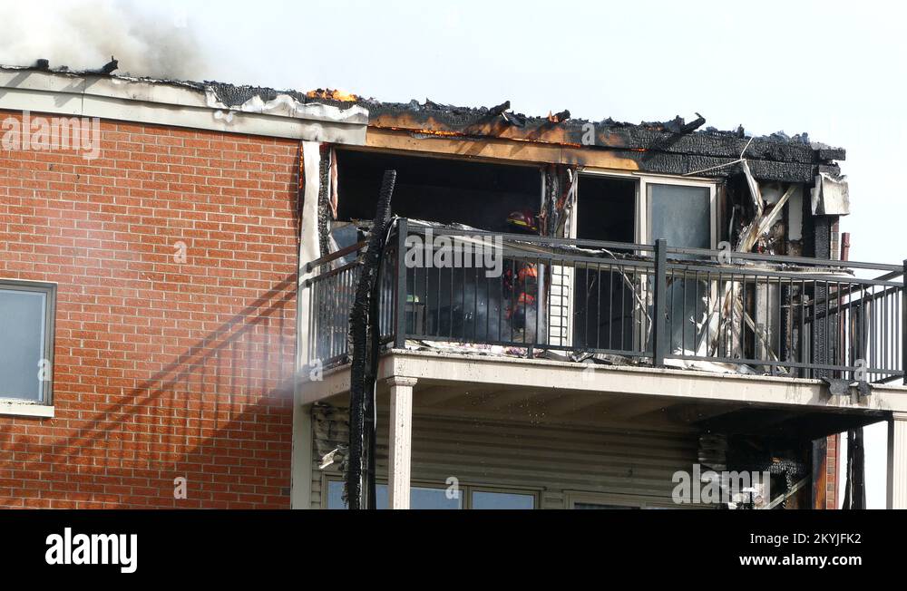 Fire fighter seen inside building thru wall ripped open while still on ...