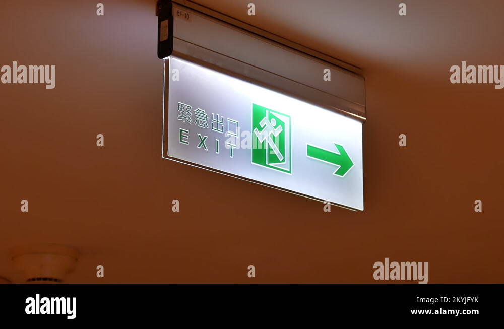 Motion of emergency exit sign on ceiling inside shopping mall with 4k ...