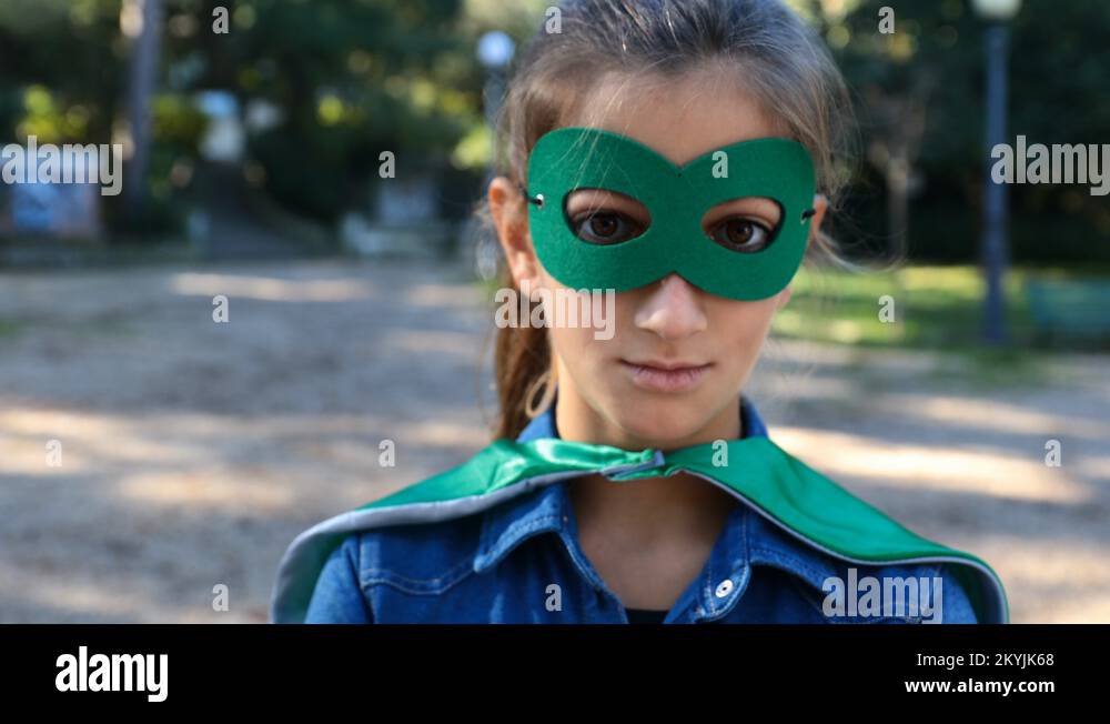 Proud brave teenager girl superhero with arms crossed looking at the ...