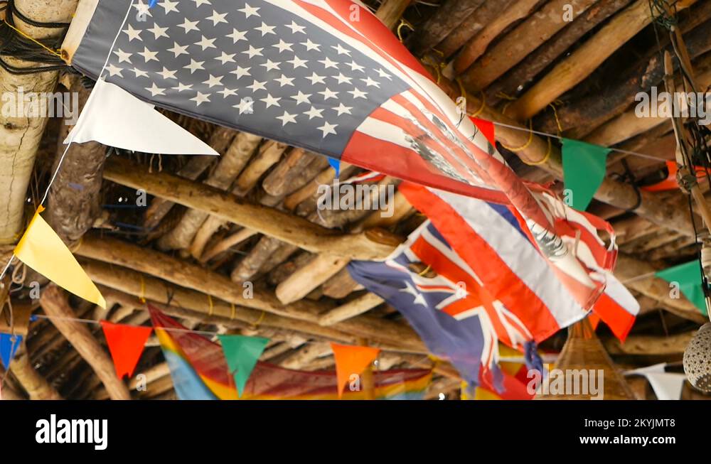 Decorative national flags of different countries hanging on strings in ...