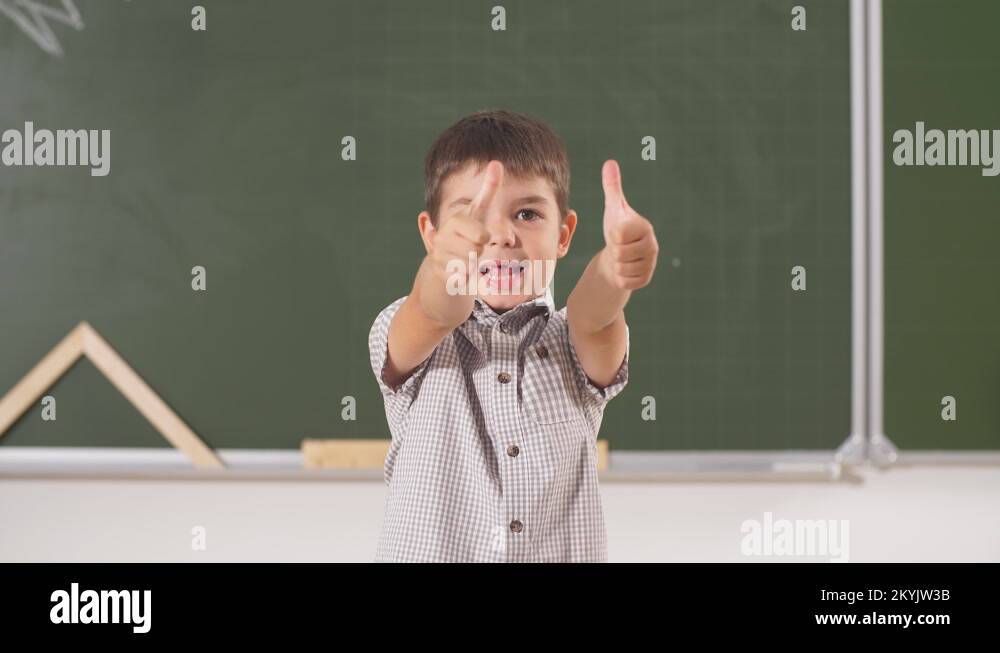 smiling boy thumb up going to school for first time. Kid indoor class ...