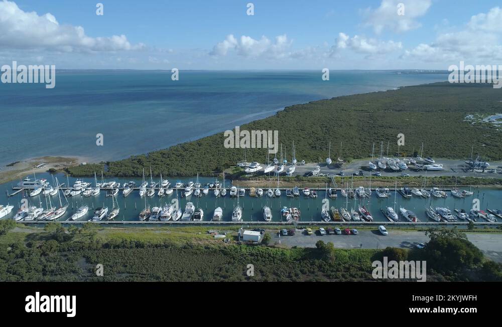 Forward flight with downward camera tilt over moored boats in ...
