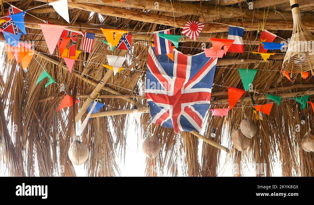 Decorative national flags of different countries hanging on strings in ...